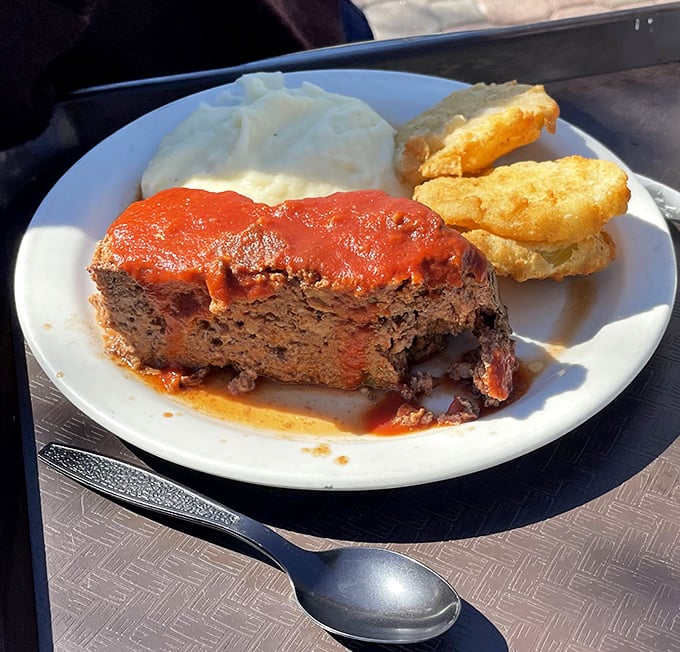 Meatloaf that would make your mama jealous, paired with cloud-like mashed potatoes. This isn't dinner—it's edible nostalgia on a plate.