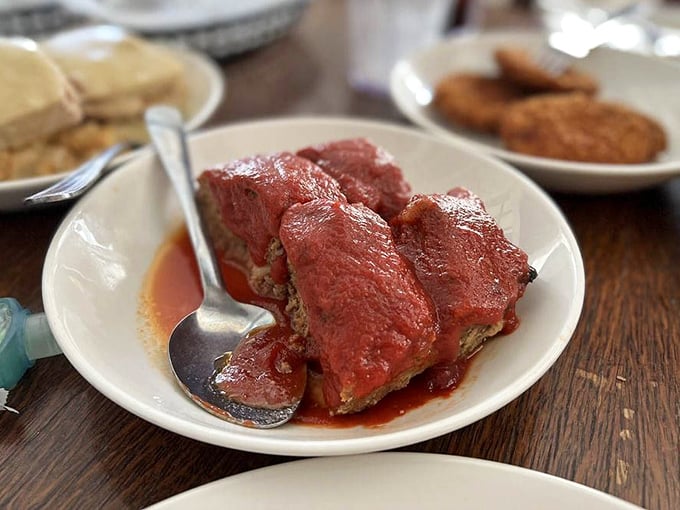 Meatloaf that doesn't apologize for being meatloaf – hearty, homestyle, and draped in a tomato sauce that means business.