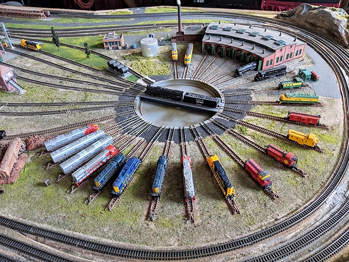 This miniature railway wonderland proves that grown men never outgrow their toys, they just get more elaborate with their excuses.