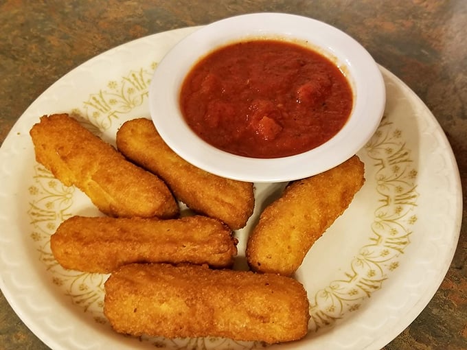 Golden-brown mozzarella sticks with that perfect cheese pull, served with marinara that's worth the inevitable shirt stain.