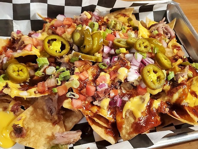 BBQ nachos that make sharing impossible. That pulled pork nestled among jalapeños and cheese creates neighborhood disputes over the last chip.