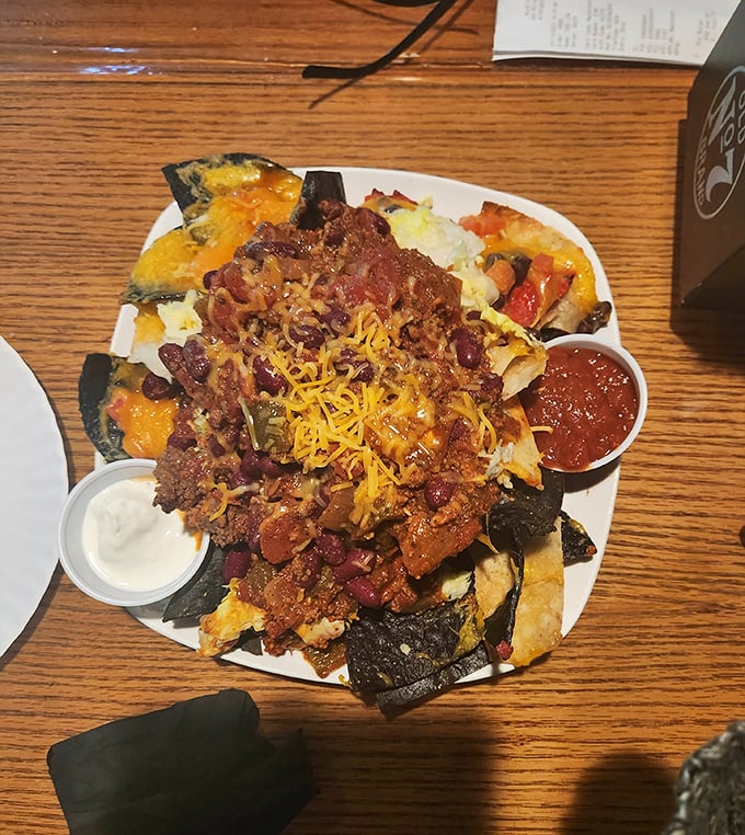 These loaded nachos aren't messing around—they're the United Nations of bar food where every country is delicious.