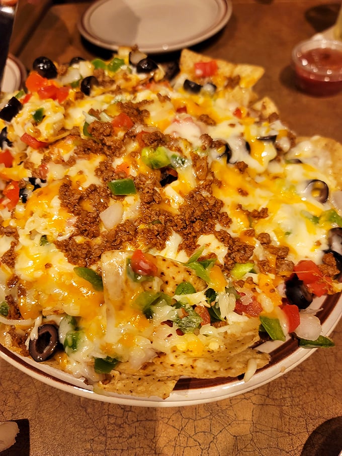 Loaded nachos that require a strategy to eat—like a delicious game of Jenga where everyone wins, especially your taste buds.