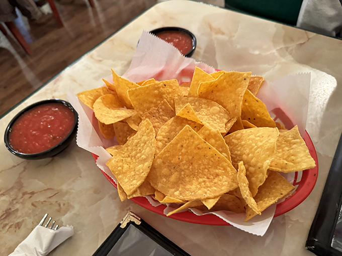 Golden, crispy tortilla chips that actually hold up to salsa-scooping—the unsung heroes of any Mexican meal worth its salt.