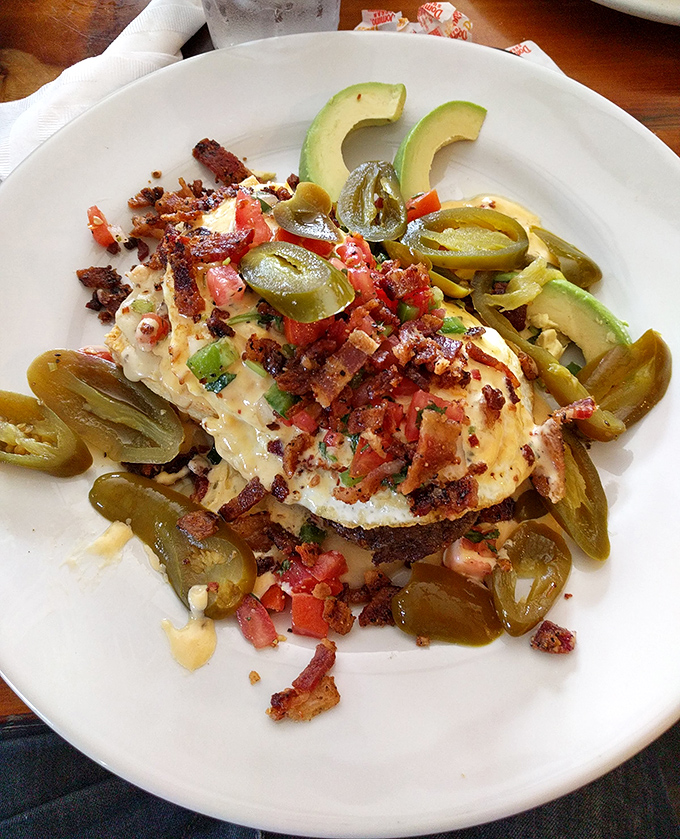 Breakfast gets the Texas treatment with this loaded plate. Jalapeños, bacon, and avocado turn ordinary eggs into a fiesta.