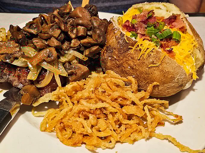 When your steak arrives with perfectly sautéed mushrooms, a loaded baked potato, and crispy onion straws, you know you've made excellent life choices.