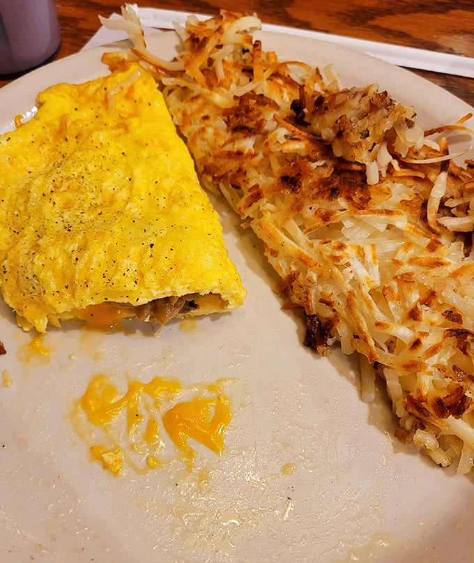 This omelet and hash browns combo isn't just breakfast—it's edible sunshine paired with crispy potato perfection.
