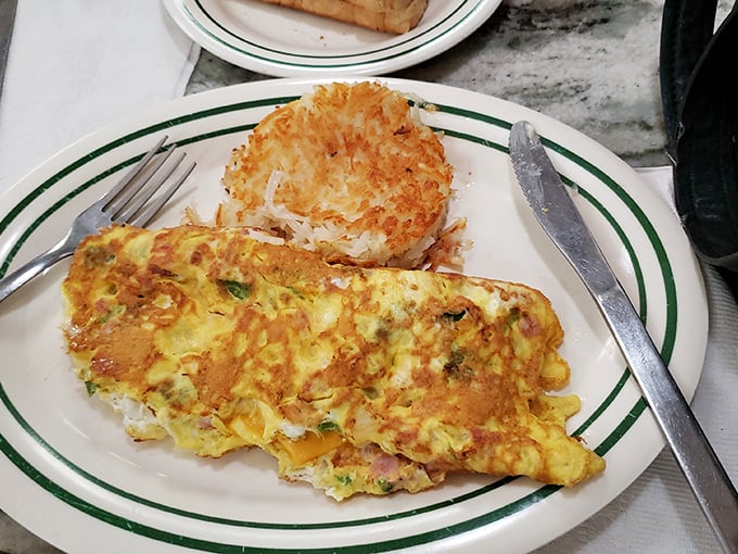 This isn't just an omelet – it's a masterclass in breakfast architecture, with perfectly browned edges and a fluffy interior.