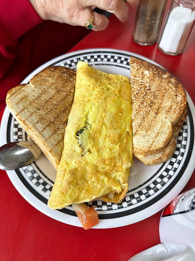 This fluffy omelet with perfectly toasted bread represents everything wonderful about traditional American breakfast craftsmanship.