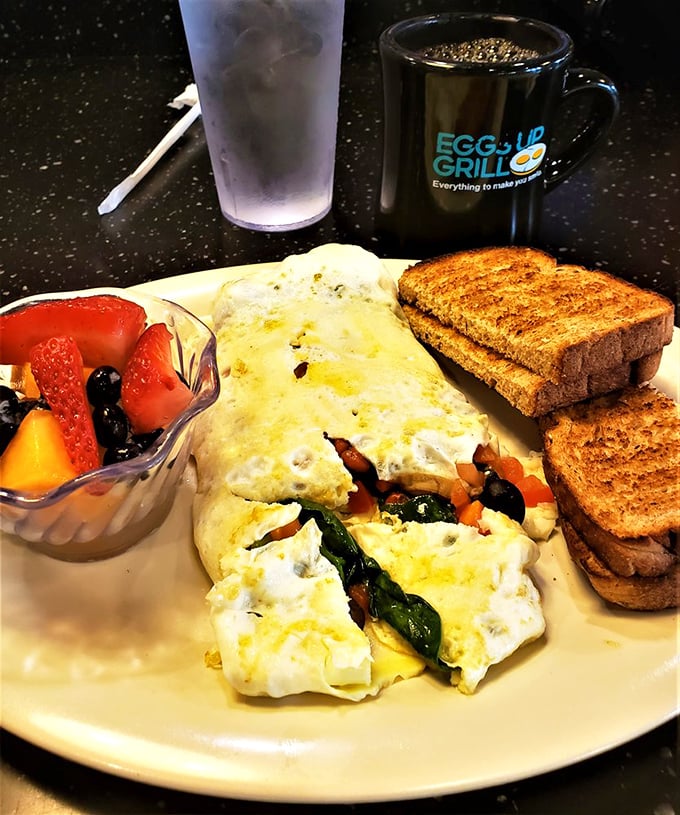 This omelet has more stuffing than your holiday turkey! Fresh veggies peek out like they're playing hide-and-seek with your fork.