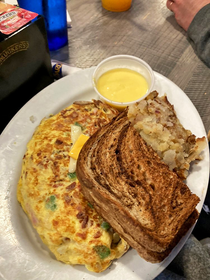 Whoever said "you can't improve on perfection" clearly never met this omelet—a masterclass in breakfast architecture with just the right cheese-to-veggie ratio. 