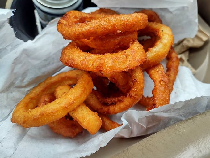 These onion rings aren't just side dishes—they're golden halos of happiness that crunch with a satisfying snap before melting into sweet onion bliss.