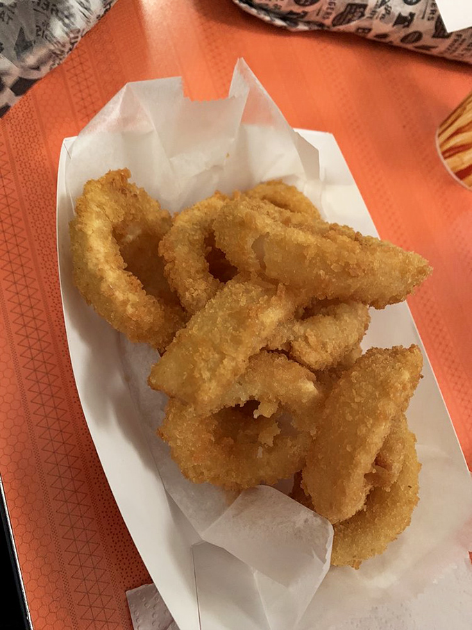 Golden-brown onion rings with that perfect crunch-to-softness ratio. The supporting actor that occasionally steals the scene from the headliner.