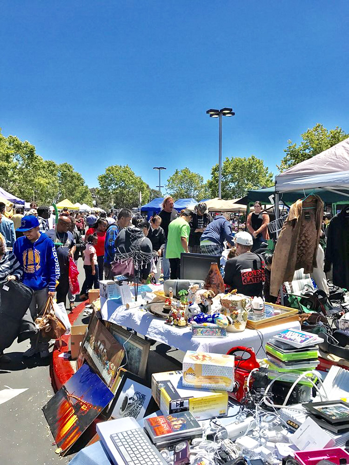 The heartbeat of the market – shoppers weaving between tables under California's blue skies, each on their own treasure quest.