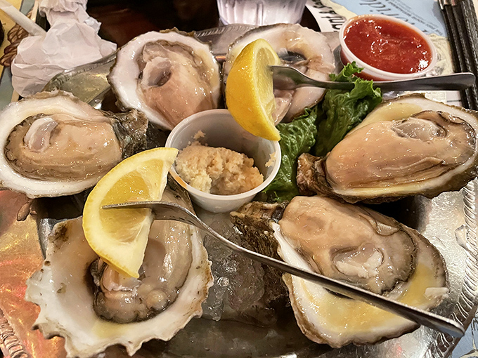 These oysters aren't just served, they're presented – plump, glistening treasures from the sea with lemon wedges standing by for duty.