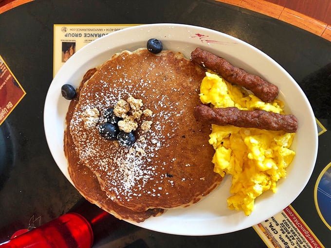Pancakes so massive they deserve their own zip code, dusted with powdered sugar like the gentlest Arizona snowfall you'll ever see.