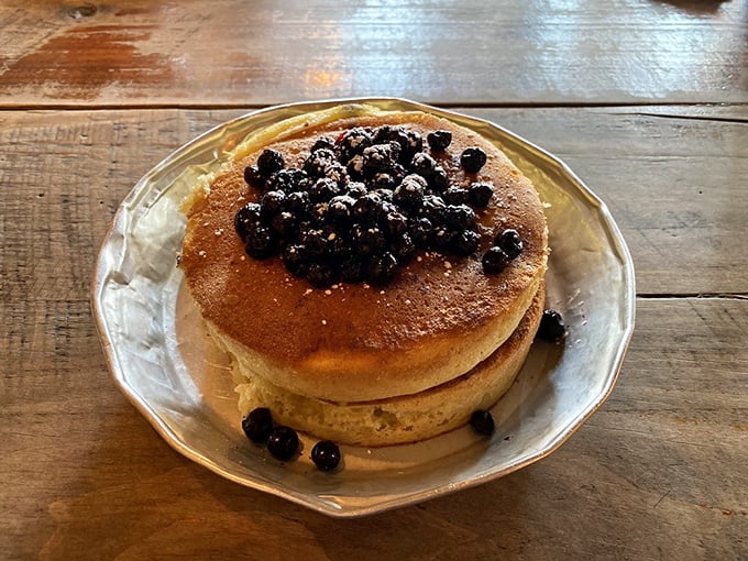 Pancakes that don't need a filter—golden, fluffy, and topped with fresh blueberries. Breakfast doesn't get more photogenic than this.