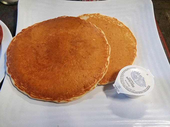 These golden pancakes aren't just breakfast—they're edible sunshine, perfectly sized to cover the plate and your morning hunger pangs.