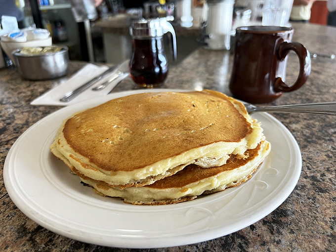 These pancakes aren't just breakfast, they're therapy—golden-brown discs of comfort that make Monday mornings bearable again.