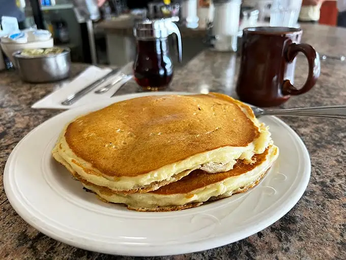 These pancakes aren't just breakfast, they're therapy—golden-brown discs of comfort that make Monday mornings bearable again.