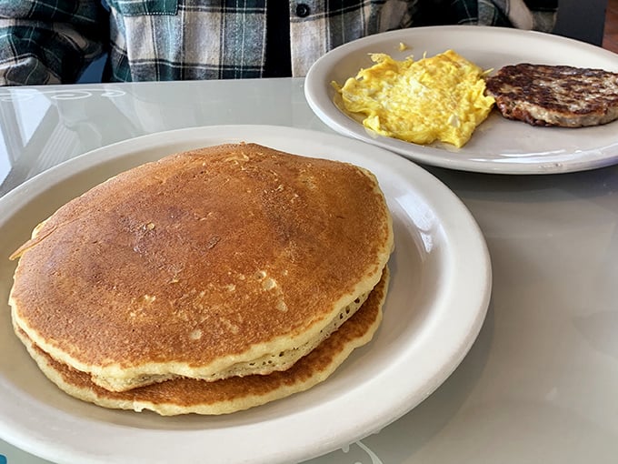 Pancakes so perfectly golden they deserve their own medal ceremony – fluffy enough to use as a pillow if you weren't so busy devouring them.