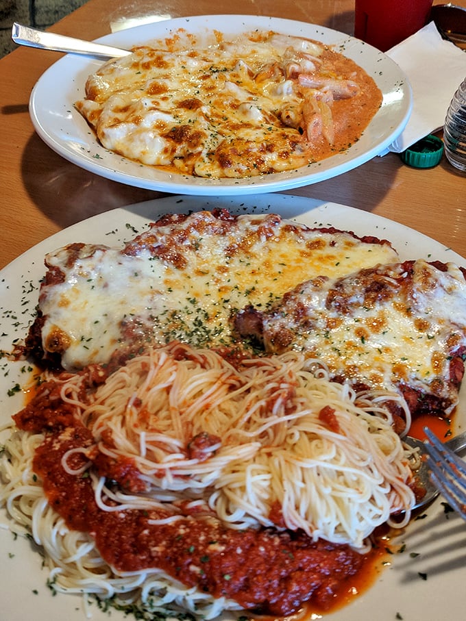 Italian-American comfort on a plate: golden chicken parmesan nestled beside spaghetti with red sauce that would make any nonna proud.