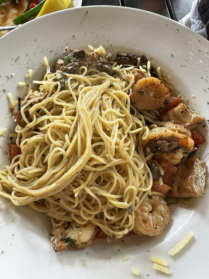 Pasta perfection with seafood companions. These noodles aren't just along for the ride—they're sharing the spotlight with plump shrimp.