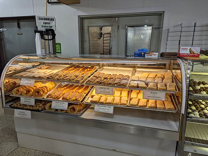 The pastry case: where diets come to die happy deaths. These donuts and cream sticks aren't just baked goods—they're little works of art with sugar as the medium.