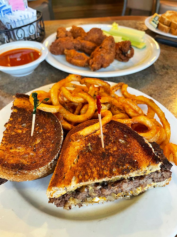This patty melt with curly fries isn't just lunch; it's therapy on a plate. The crispy-to-gooey ratio is mathematical perfection.