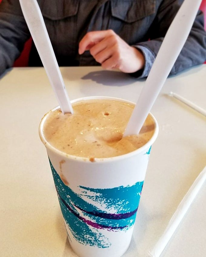 Two straws, one shake—either a romantic gesture or a tactical advantage. This peanut butter masterpiece demands serious sipping strategy.