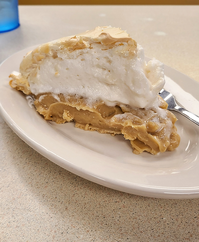 This peanut butter pie with its cloud-like meringue isn't just dessert—it's an edible time machine to your grandmother's kitchen.
