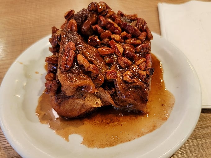 Not just a pecan roll—a monument to morning indulgence. The caramelized pecans create a sweet armor that protects the tender cinnamon-scented interior.
