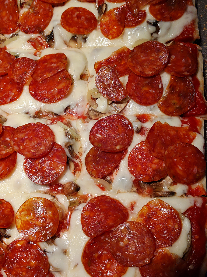 Pepperoni that curls into little flavor cups, melted cheese stretching with each bite – this is the pizza equivalent of hitting the lottery.
