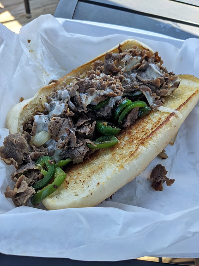 The Philly cheesesteak that makes actual Philadelphians question their hometown loyalty – meat mountain meets cheese avalanche.