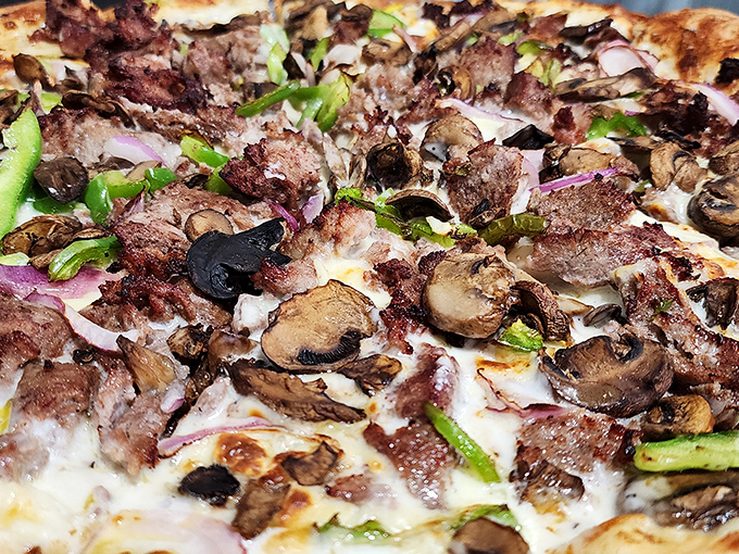 The legendary Philly Cheesesteak Pizza in all its glory. Where Philadelphia tradition meets Ohio innovation in a cheese-pull worthy of Olympic gold.