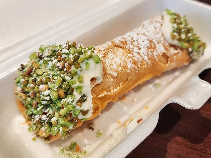 This cannoli isn't just dessert—it's the encore after the beef symphony. Pistachio-studded ends add a nutty crescendo to the sweet finale. 