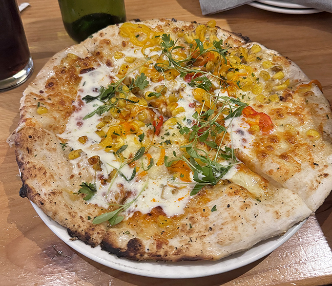 This isn't just pizza—it's a wood-fired canvas where local ingredients perform a beautiful dance of flavor and texture.