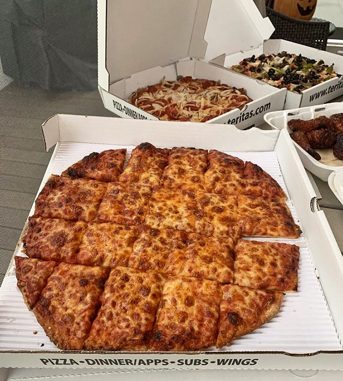 The holy trinity of Terita's boxes – cheese, specialty, and wings. Not pictured: the willpower required to make it home without sneaking a slice.