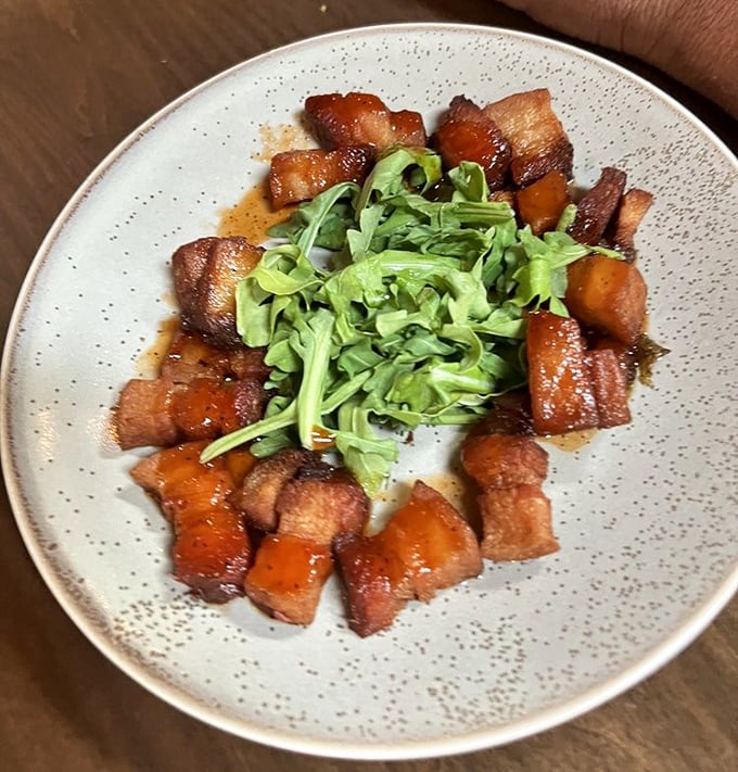 These caramelized pork belly bites with fresh greens are what would happen if comfort food went to finishing school and graduated with honors. 
