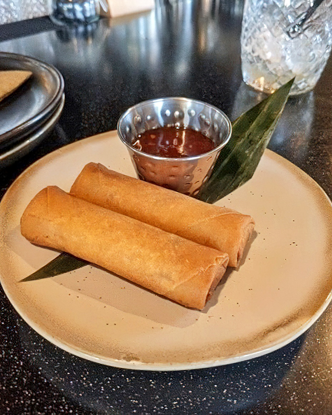 Lumpia that crackle with each bite, served with dipping sauce that makes ketchup seem like it's not even trying anymore.