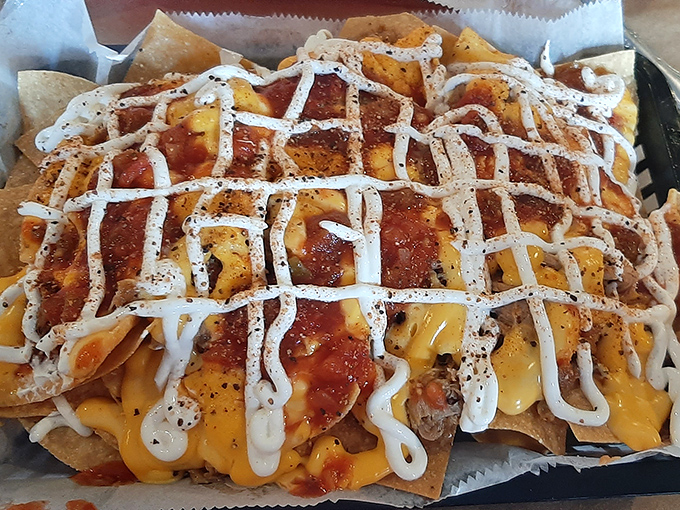 These aren't your average nachos – they're a smoky, cheesy masterpiece that redefines comfort food completely.