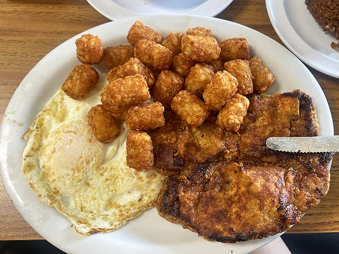 The pork chop breakfast brings dinner-quality meat to your morning – paired with those legendary hash browns that achieve crispy-yet-tender perfection.