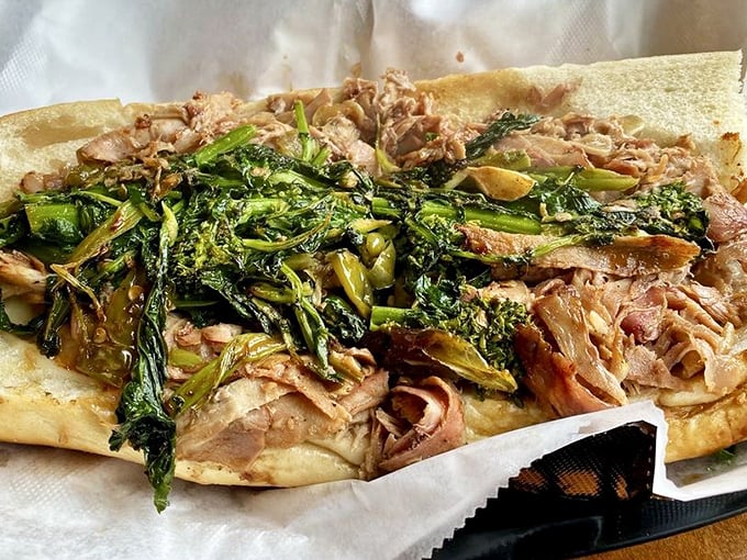 Roasted pork with broccoli rabe—where savory meat meets bitter greens in a sandwich romance that would make Shakespeare write sonnets about lunch.