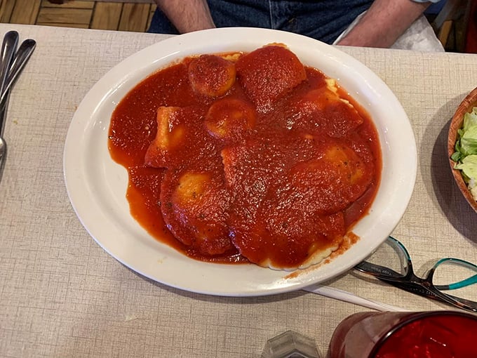 Ravioli swimming in a sea of rich tomato sauce—each pillow of pasta promising a flavor explosion that would make any Italian grandmother nod in approval.
