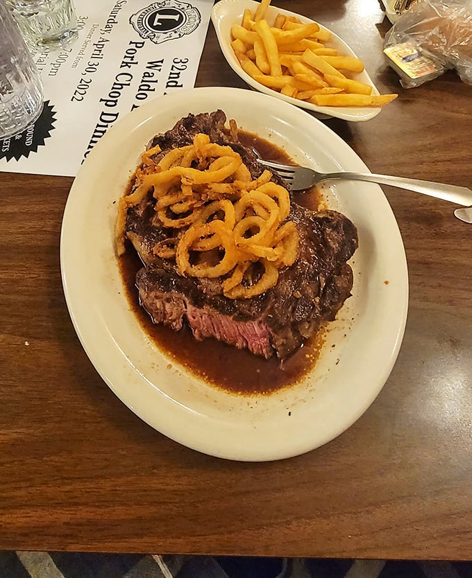Prime rib that doesn't mess around. Topped with crispy onion strings and swimming in au jus – this is Wisconsin's idea of portion control.