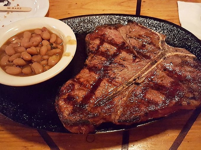 Grill marks aren't just decoration – they're the autograph of a chef who knows exactly what they're doing. This T-bone speaks the universal language of delicious.