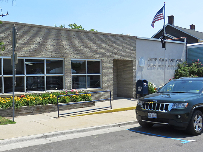 Even the post office looks like it belongs in a Norman Rockwell painting—complete with flower beds that seem to say "your bills look prettier here."