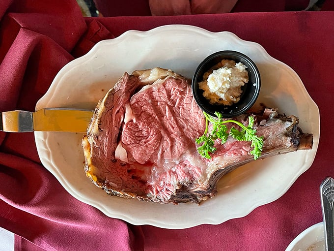 This prime rib isn't just dinner; it's an event. Perfectly pink, expertly seasoned, and garnished with just enough greenery to make you feel virtuous.