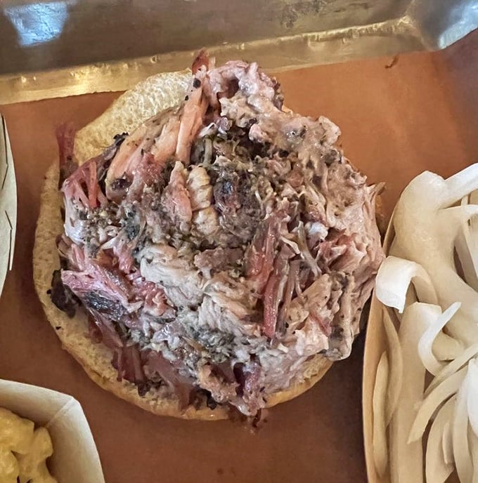 Pulled pork perfection – tender strands of smoky goodness piled high. This sandwich doesn't need a fancy introduction, just plenty of napkins.