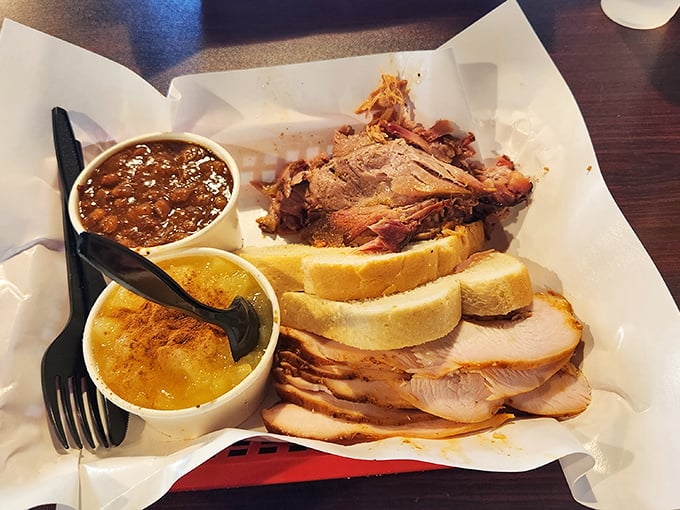 Pulled pork and sides nestled in butcher paper—the BBQ equivalent of being tucked into bed with a story. Sweet, smoky dreams are made of this.